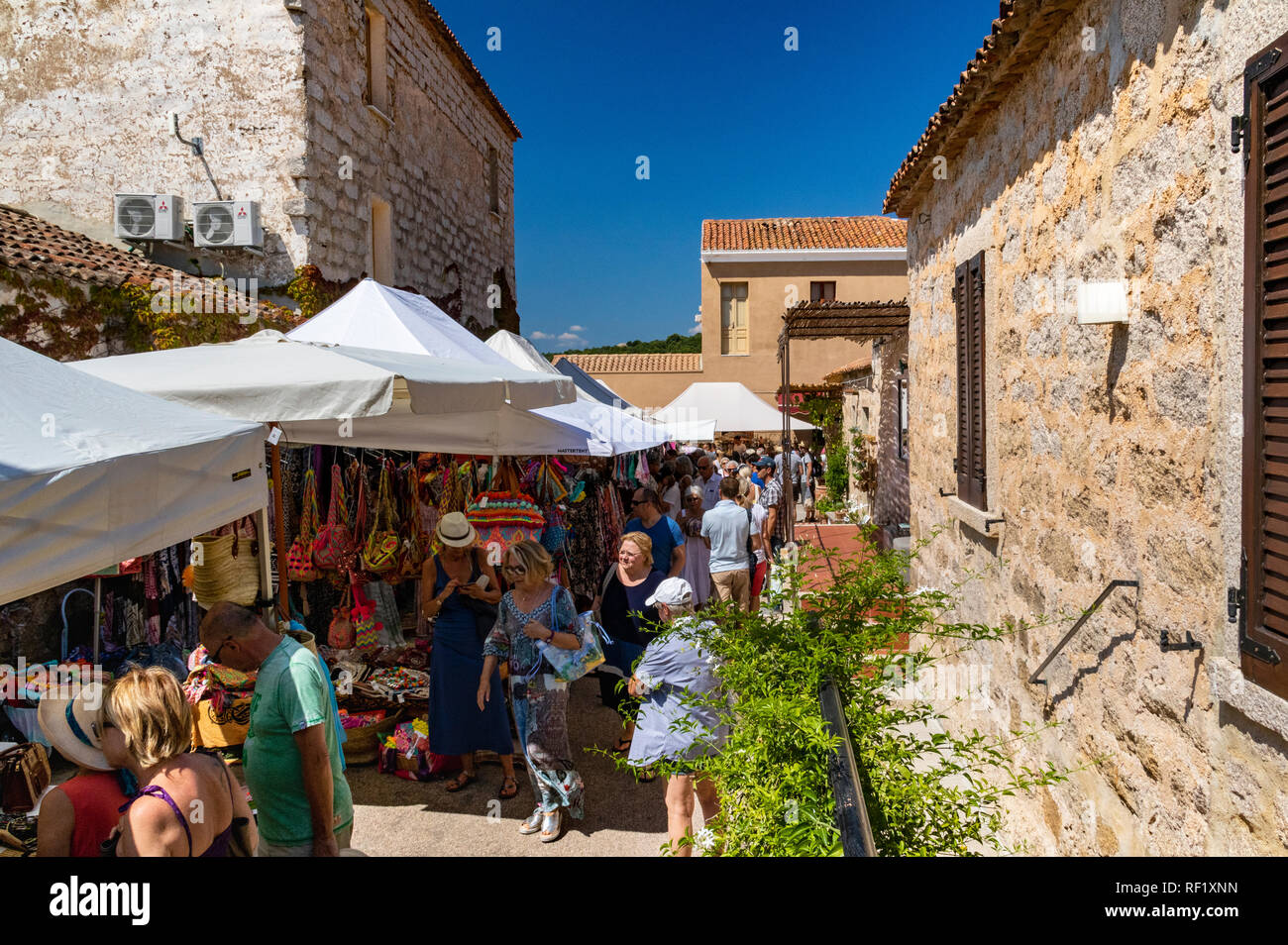 Busy Market Scene with Visitors and Stalls in a Narrow Street at the ...