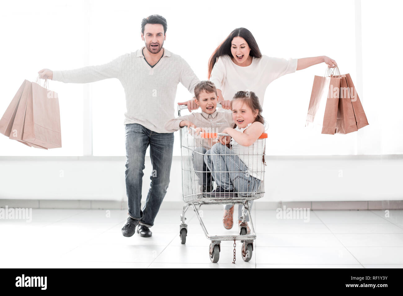 happy parents with children go shopping Stock Photo - Alamy