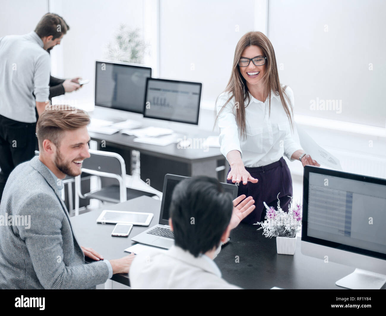 successful employees in the workplace in a modern office Stock Photo ...