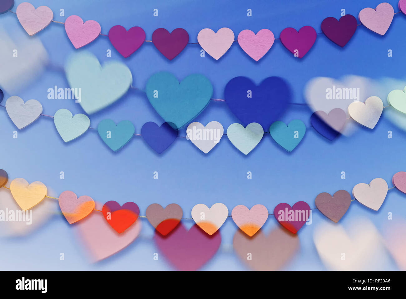 Colorful hearts on blue Stock Photo - Alamy
