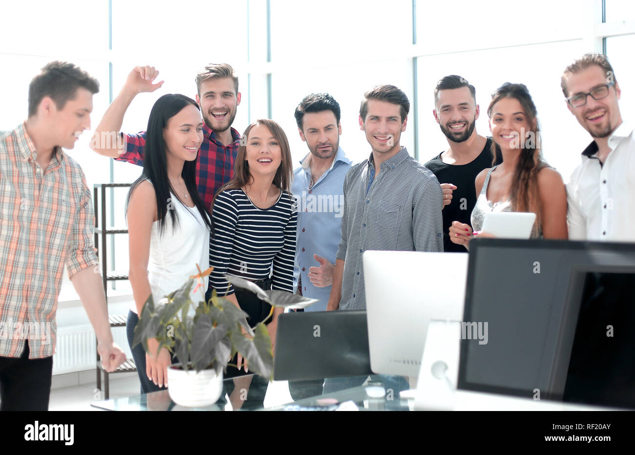 happy business team standing in new office Stock Photo - Alamy