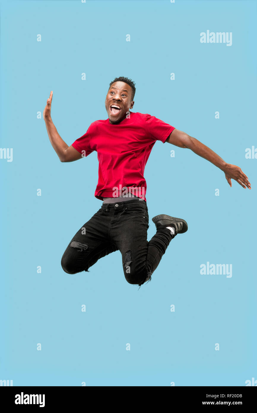 Freedom in moving and forward motion. The happy surprised young african ...
