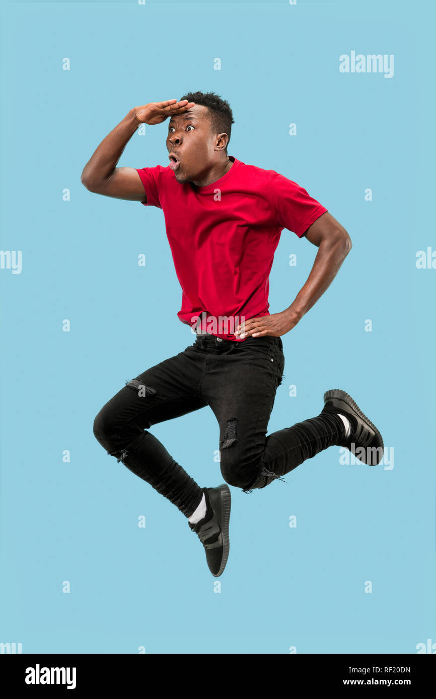 Freedom in moving and forward motion. The happy surprised young african ...