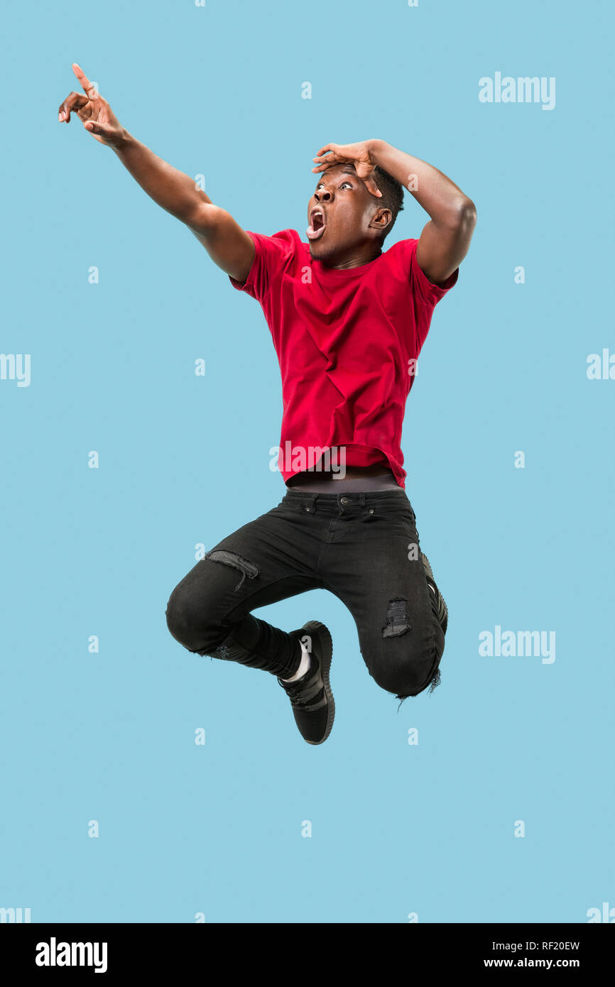 Freedom in moving and forward motion. The happy surprised young african ...