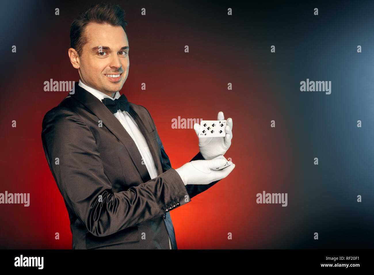 Professional Occupation. Magician in suit and gloves standing isolated ...