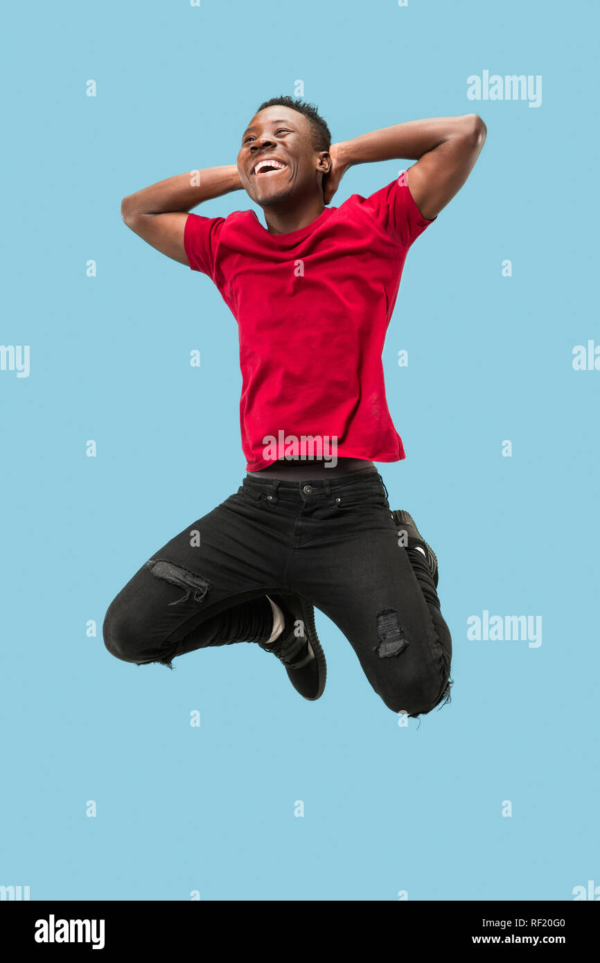 Freedom in moving and forward motion. The happy surprised young african ...