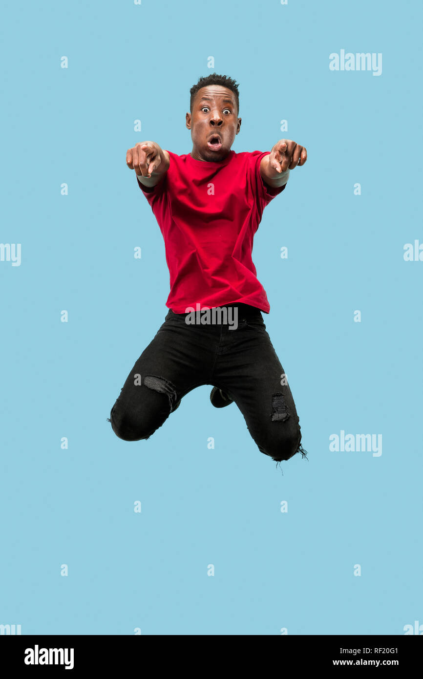 Freedom in moving and forward motion. The happy surprised young african ...