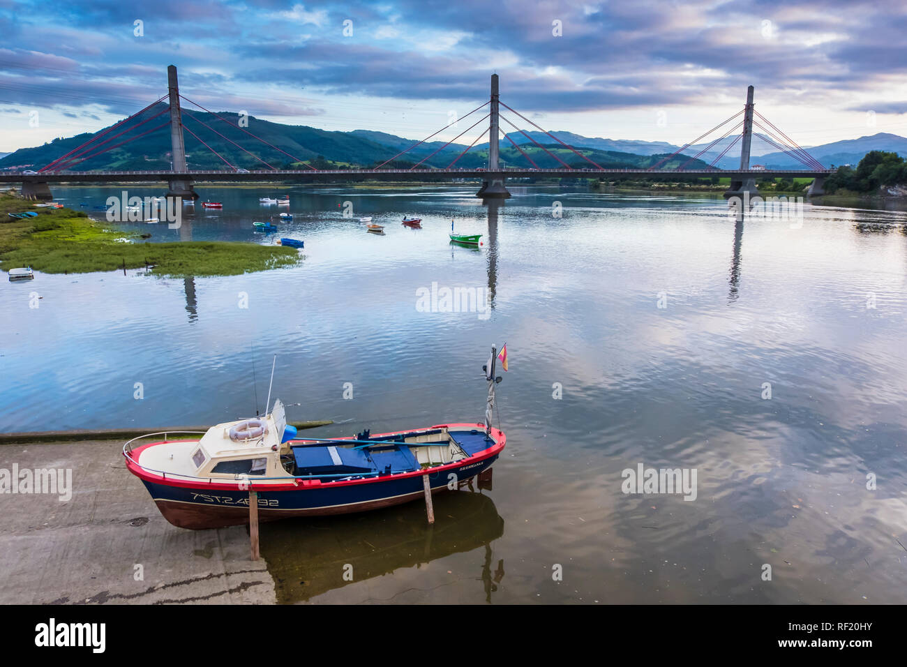 Bridge, boat and river Stock Photo - Alamy