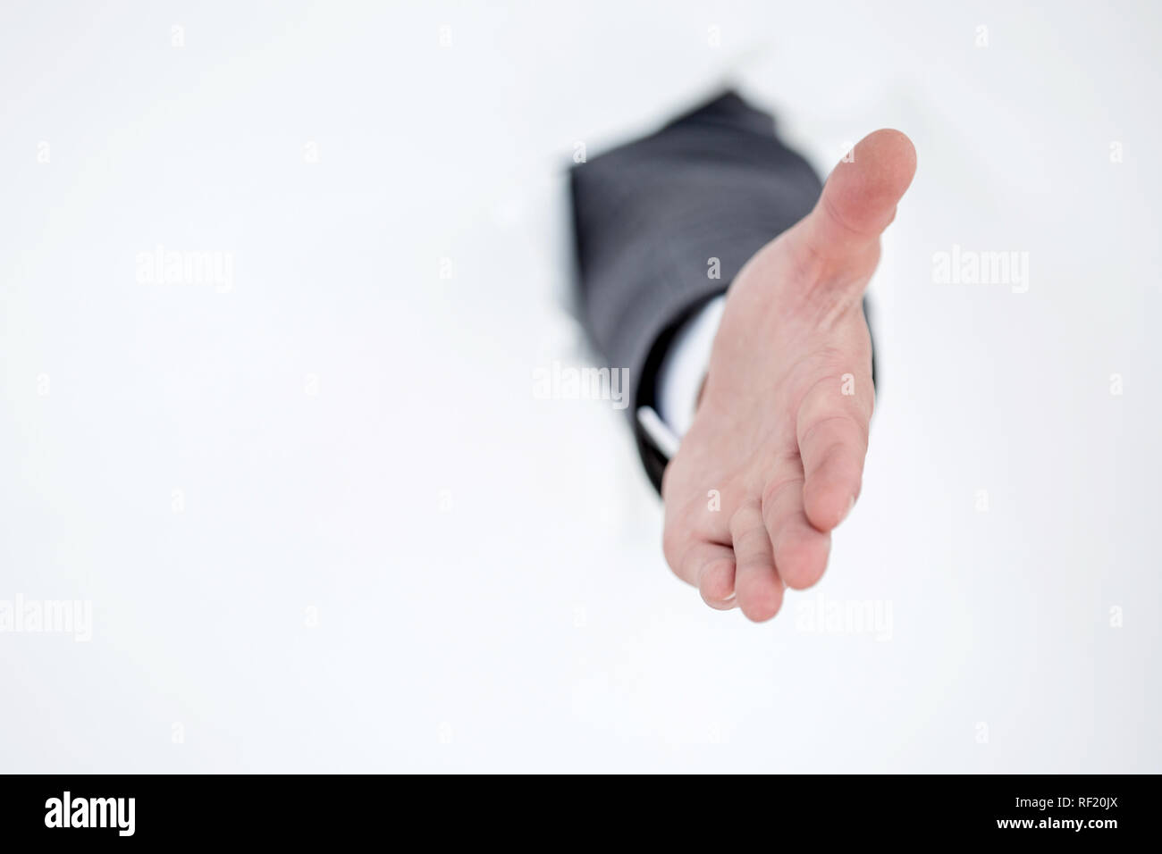 businessman holding out his hand for a handshake Stock Photo - Alamy