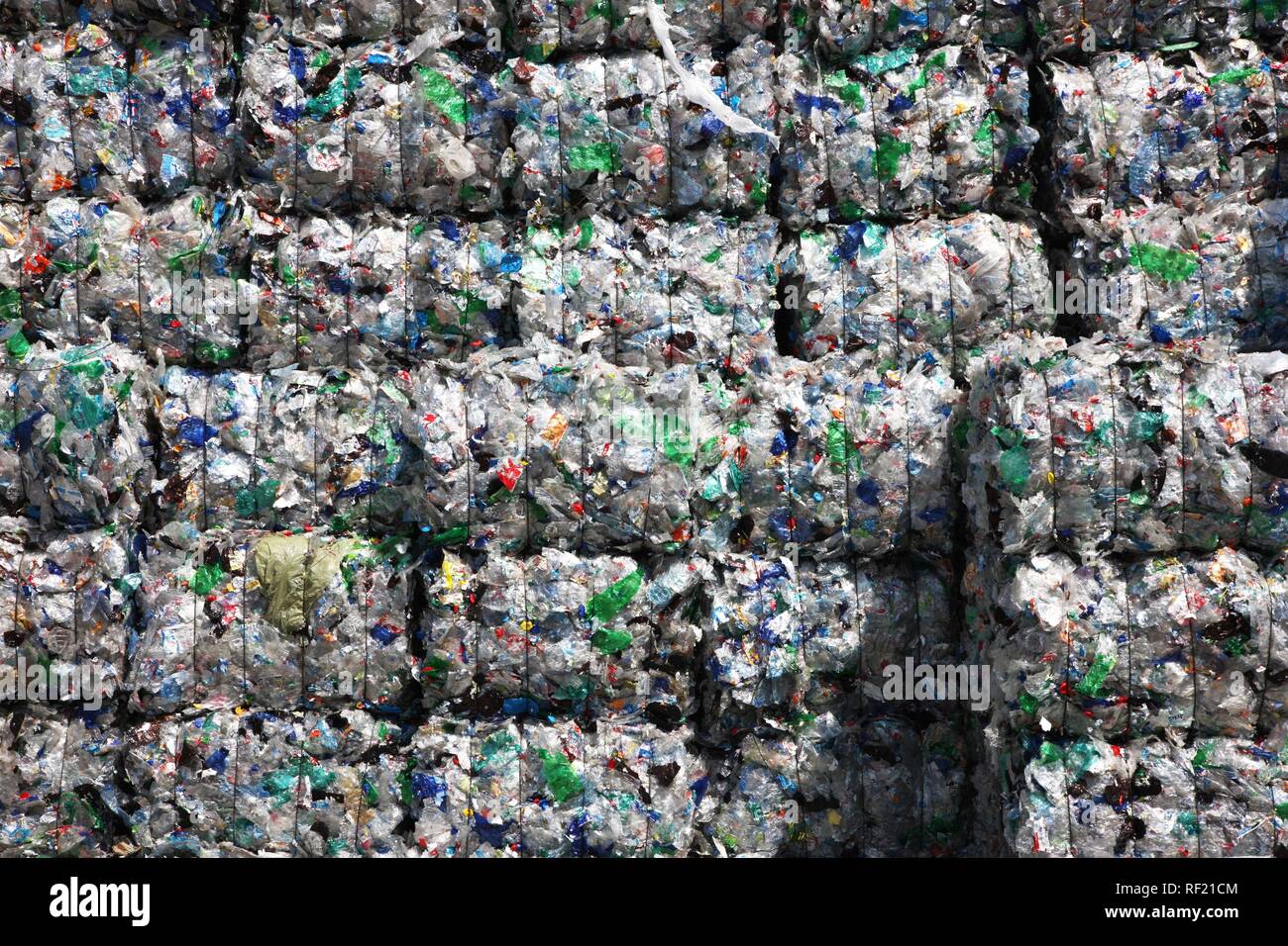 Plastic recycling, PET bottles and plastic rubbish are shredded and ...