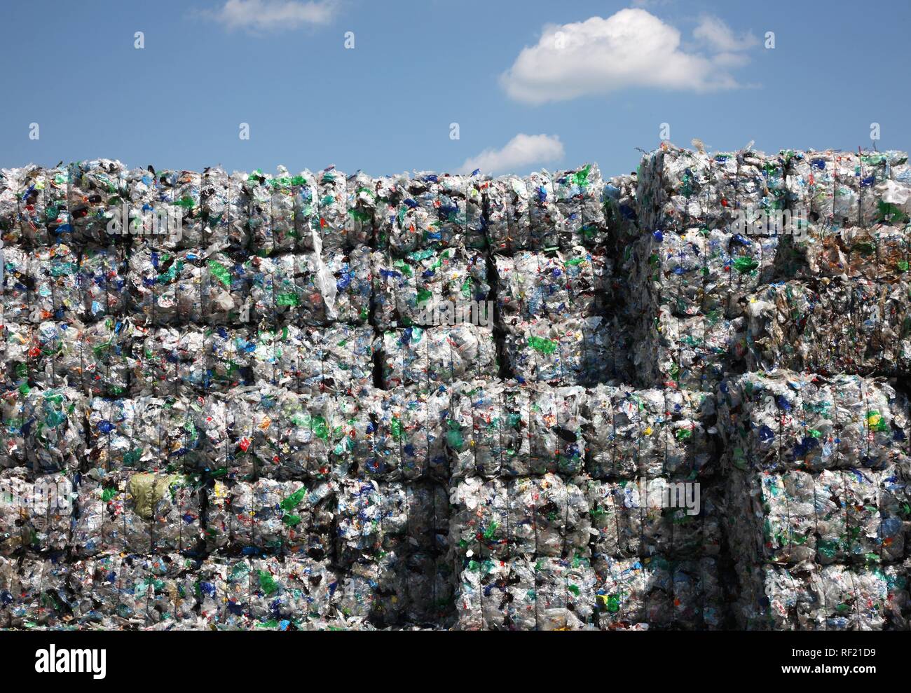Plastic recycling, PET bottles and plastic rubbish are shredded and ...