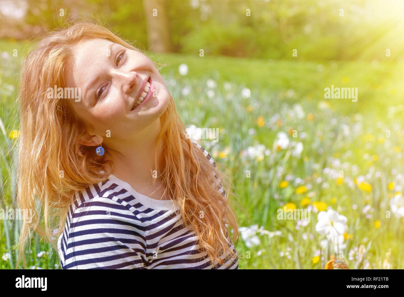 Young, happy woman in the spring sun Stock Photo - Alamy