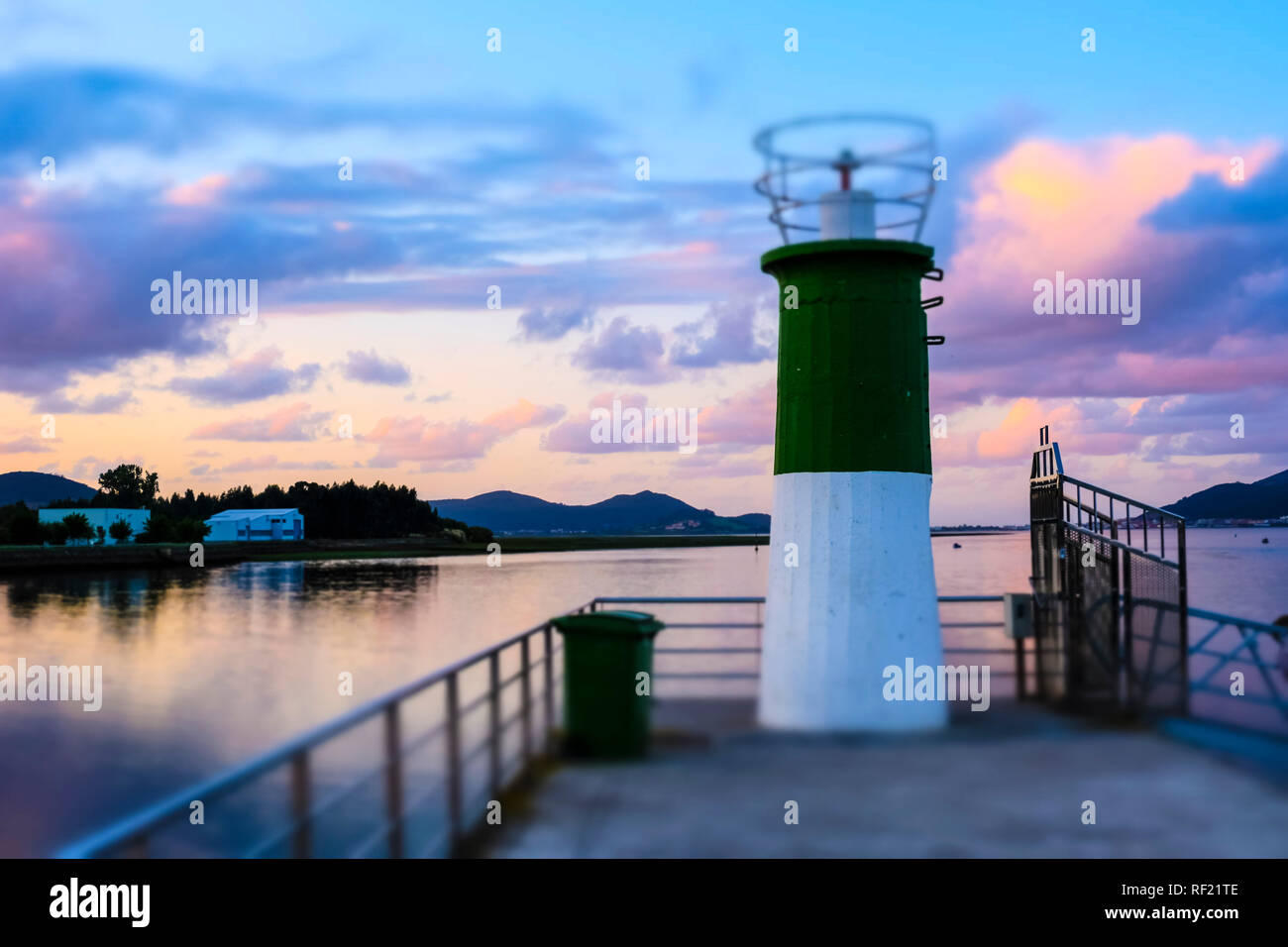 Lighthouse in a port Stock Photo - Alamy