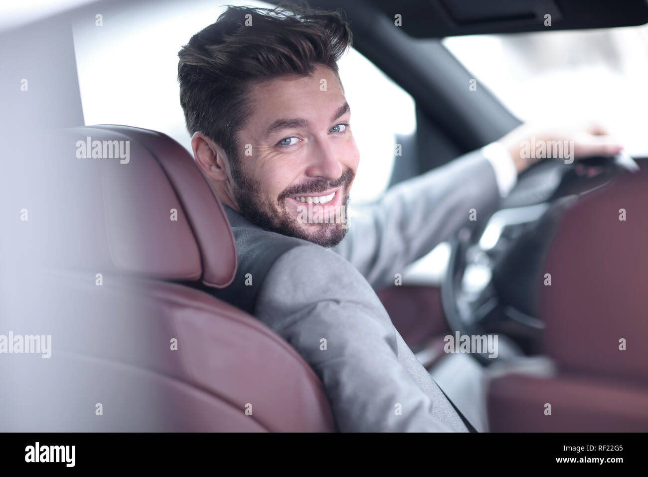Successful man sitting behind the wheel of a prestigious car Stock ...
