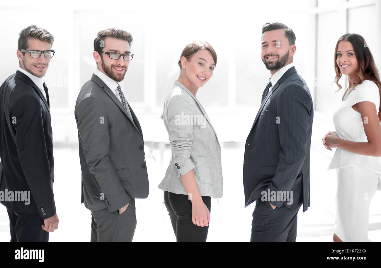 rear view.business team smiling and looking at the camera Stock Photo ...