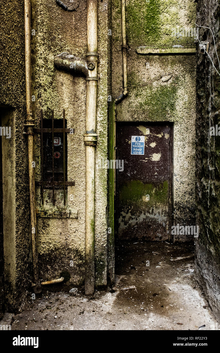 Old and damp run down back alley access fire escape Fort William ...