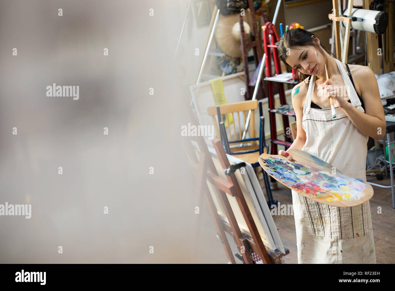 Artist draws abstract picture paints hi-res stock photography and ...