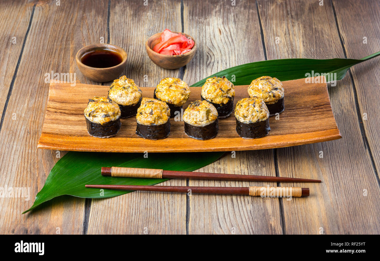 Baked sushi rolls with eel Stock Photo - Alamy