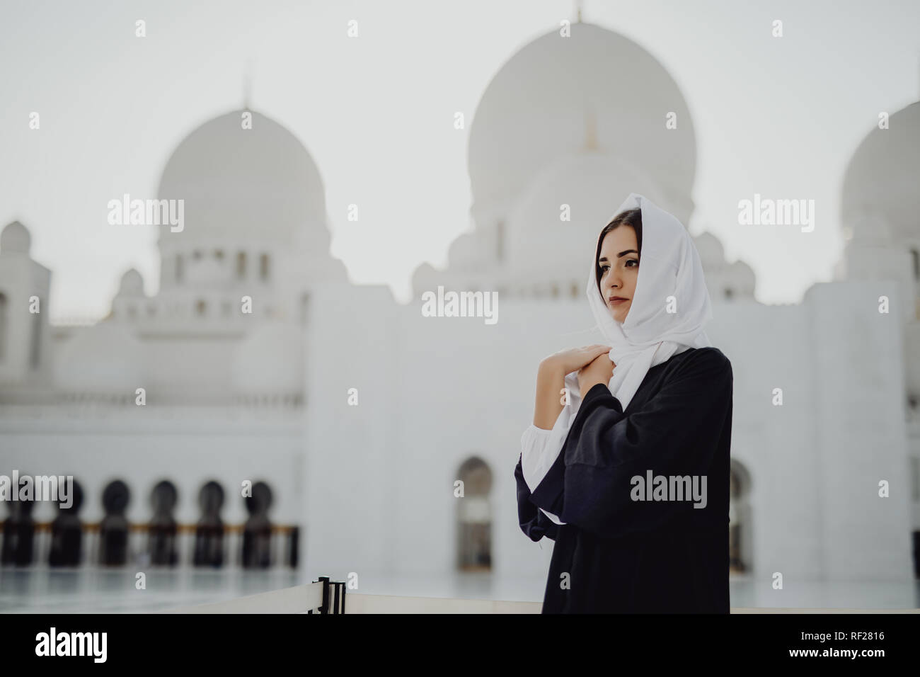 Beautiful woman in Arabic clothes at Sheikh Zayed Grand Mosque in Abu ...