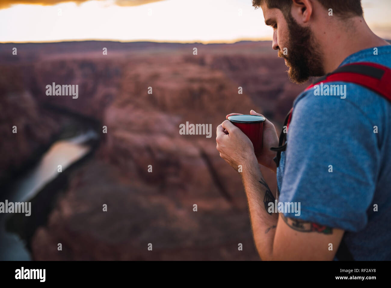 USA, Arizona, Horseshoe Bend, Young man holding red cup Stock Photo - Alamy