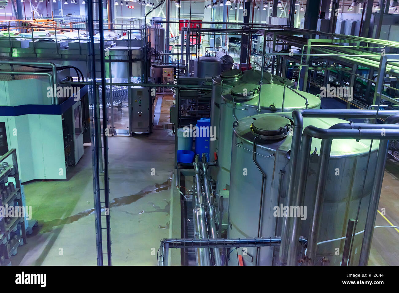 Metal reservoirs at a soft drink factory Stock Photo - Alamy