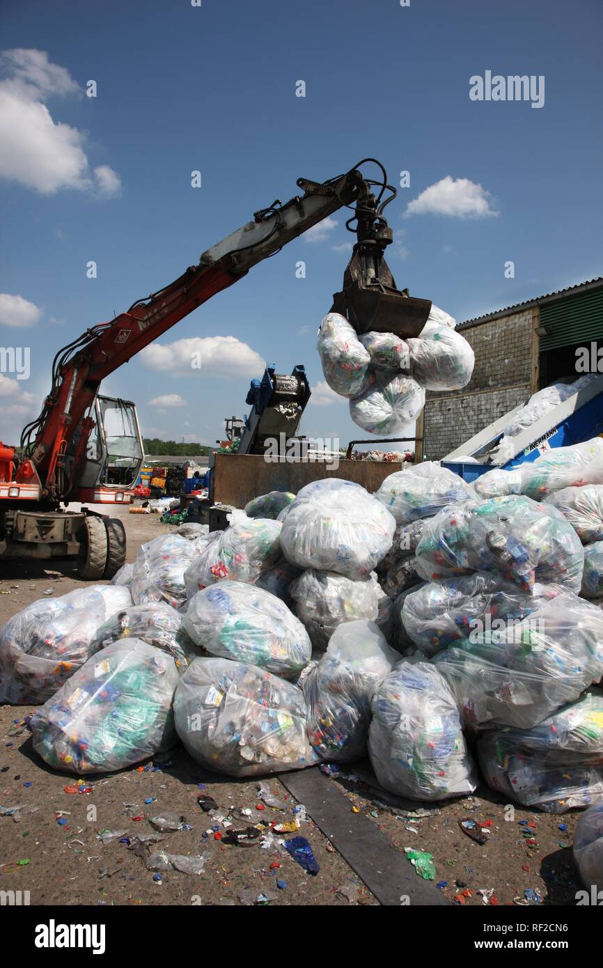 Plastic recycling, PET bottles and plastic rubbish are shredded and ...