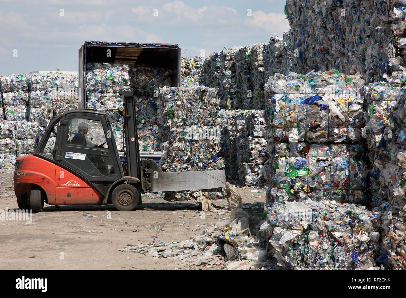 Plastic recycling, PET bottles and plastic rubbish are shredded and ...