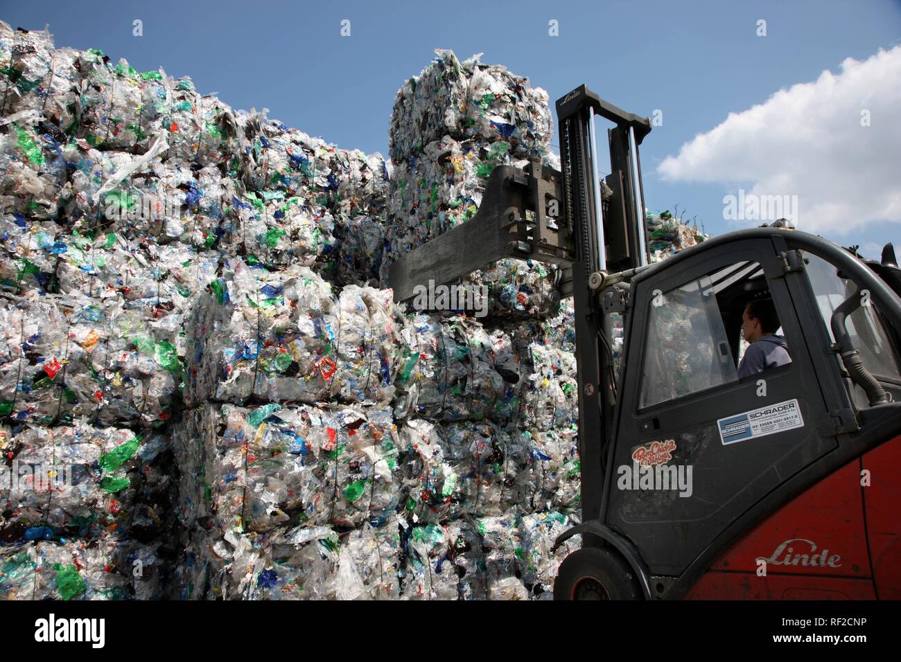 Plastic recycling, PET bottles and plastic rubbish are shredded and ...