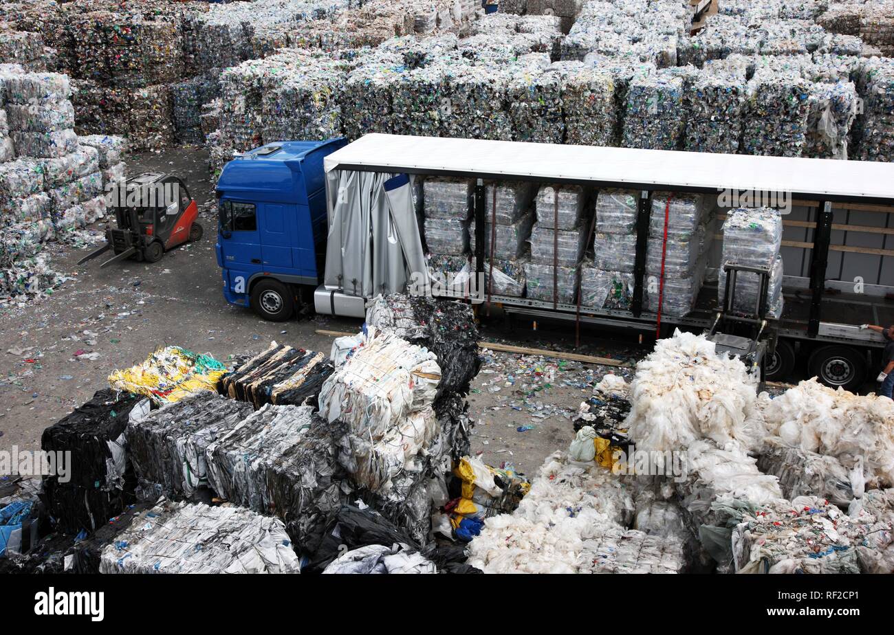 Plastic recycling, PET bottles and plastic rubbish are shredded and ...