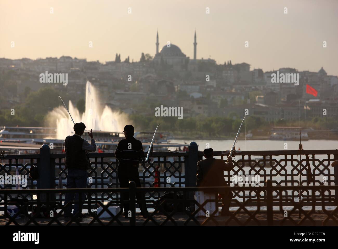 Fishermen on the Galata Bridge spanning the Golden Horn, a two-storey ...