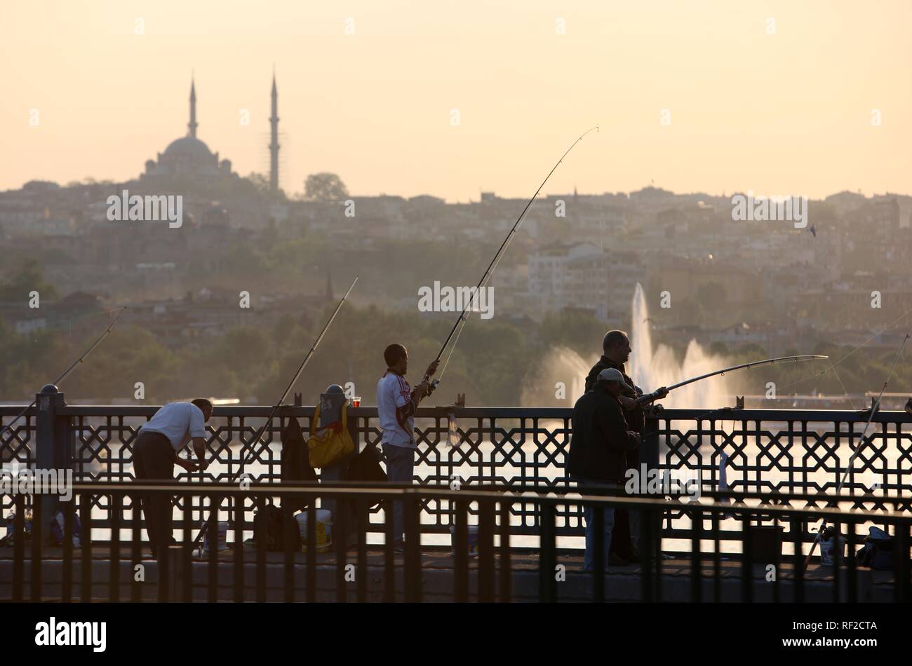 Fishermen on the Galata Bridge spanning the Golden Horn, a two-storey ...