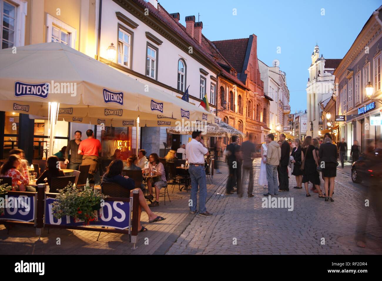 Restaurants and bars on Pilies Gatve street at night in the historic ...