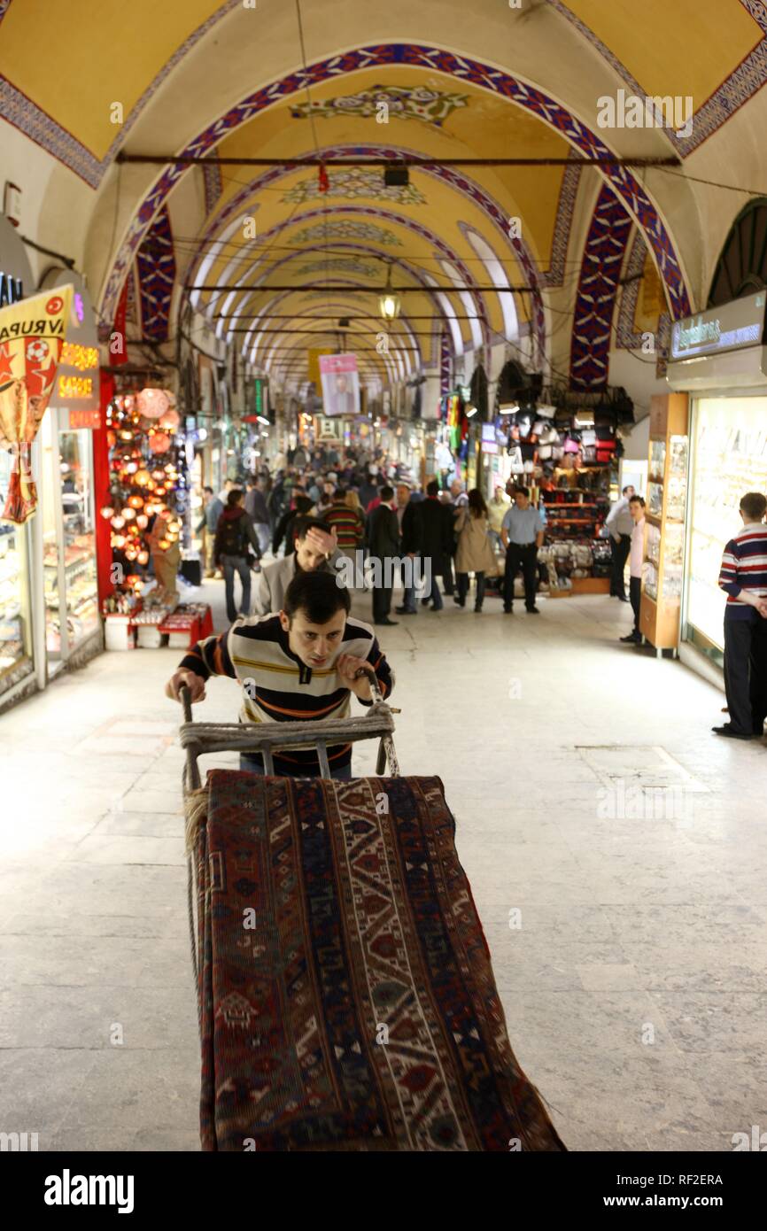 Man transporting a rug, Grand Bazar or Covered Bazar, covered market ...