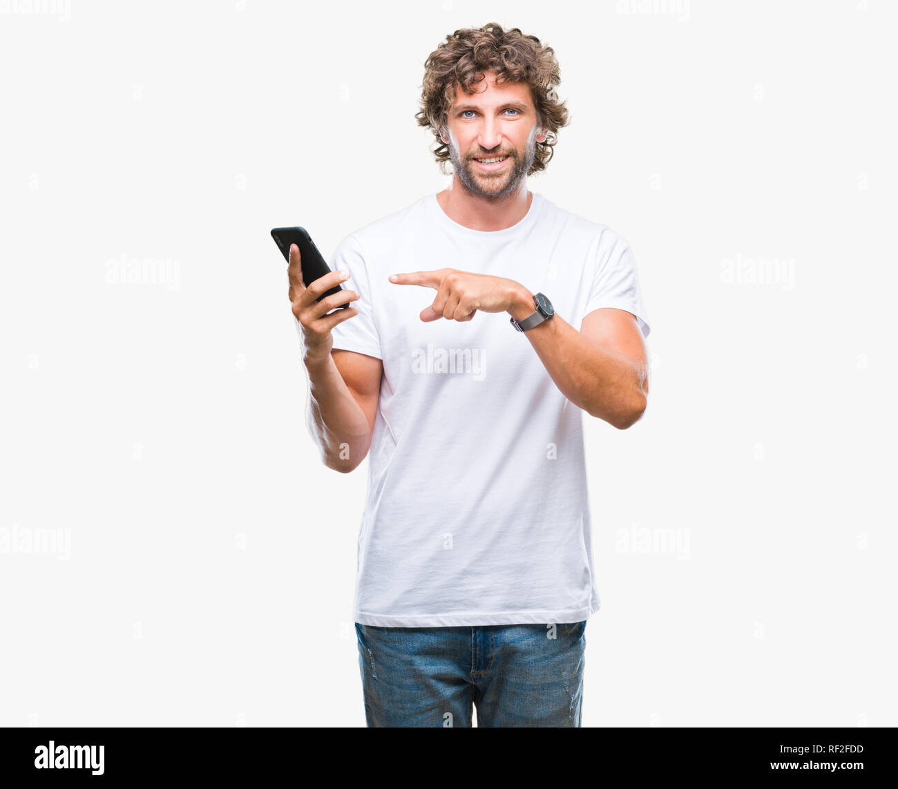 Handsome hispanic man model sending message texting using smartphone ...