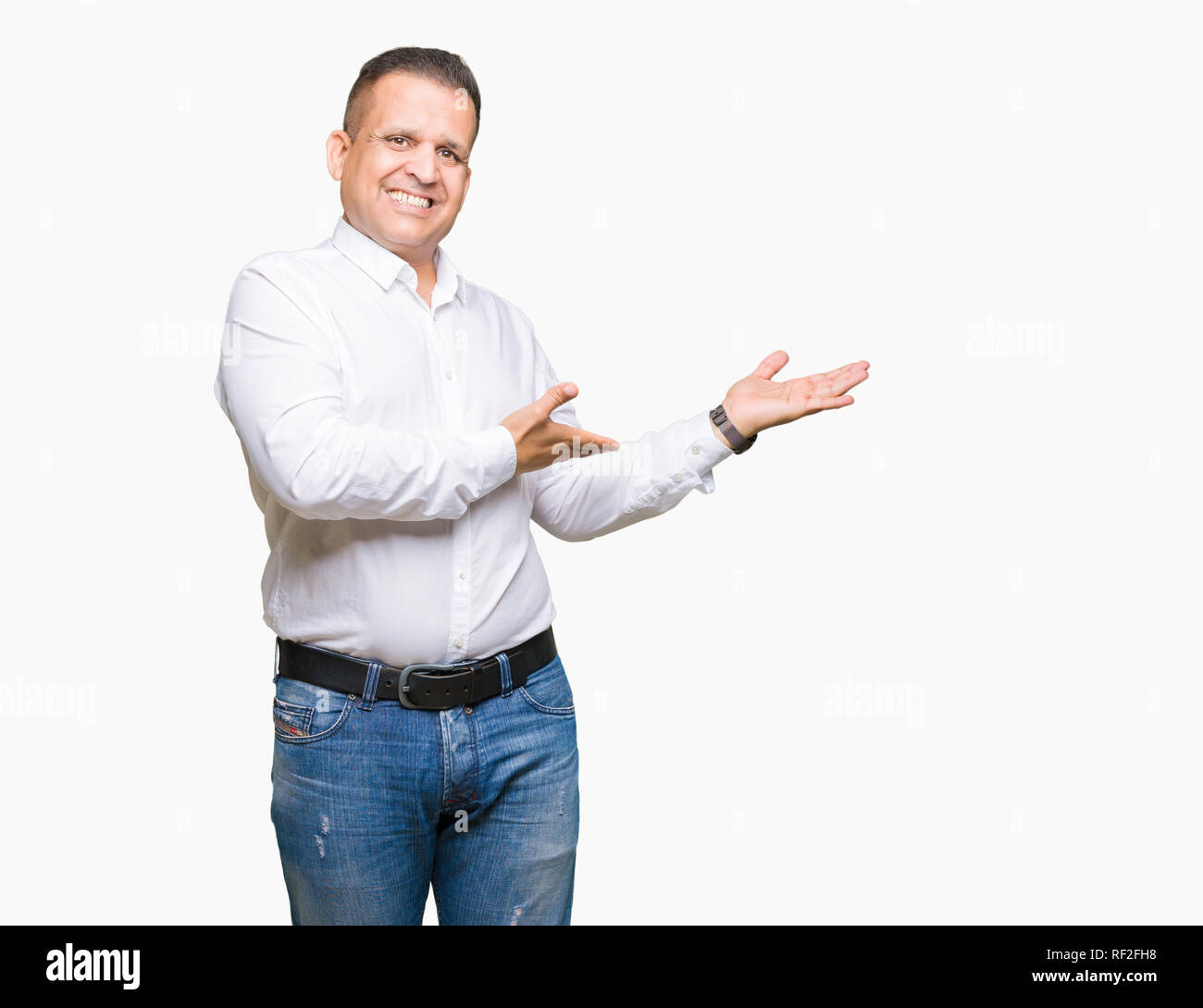 Middle age arab elegant man over isolated background Inviting to enter ...