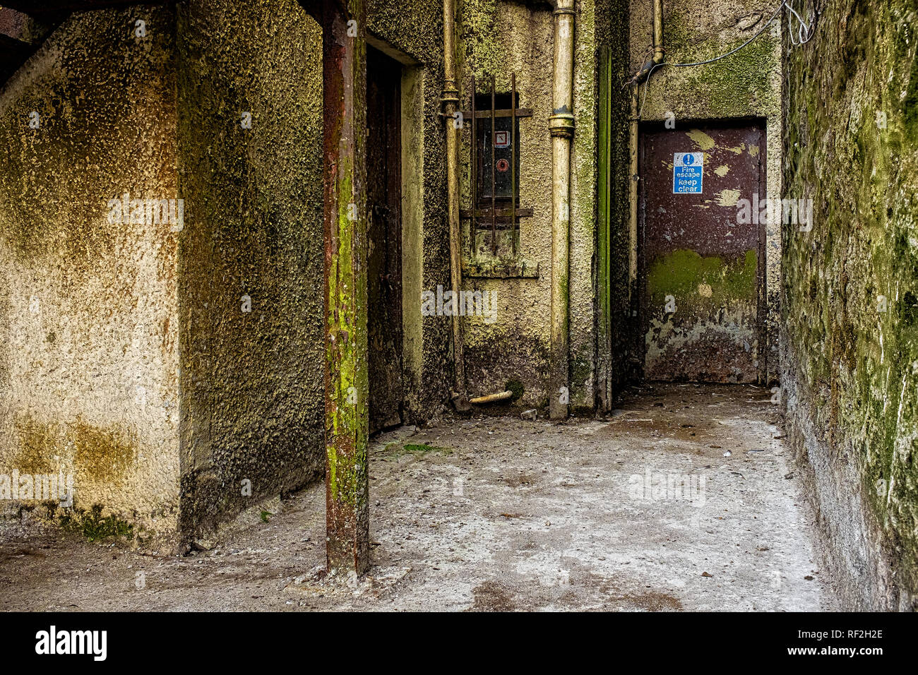 Old and damp run down back alley access fire escape Fort William ...