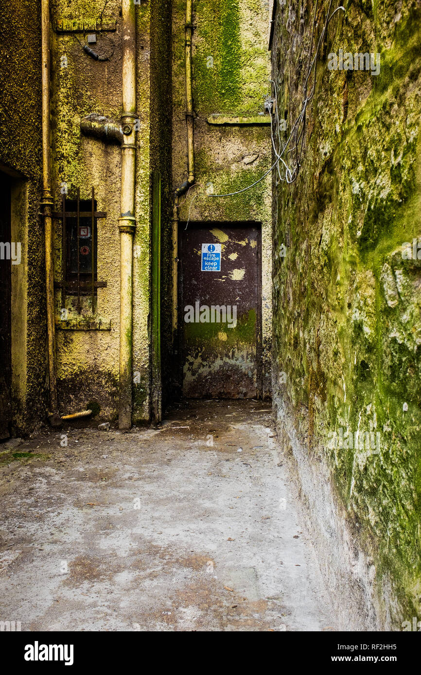 Old and damp run down back alley access fire escape Fort William ...