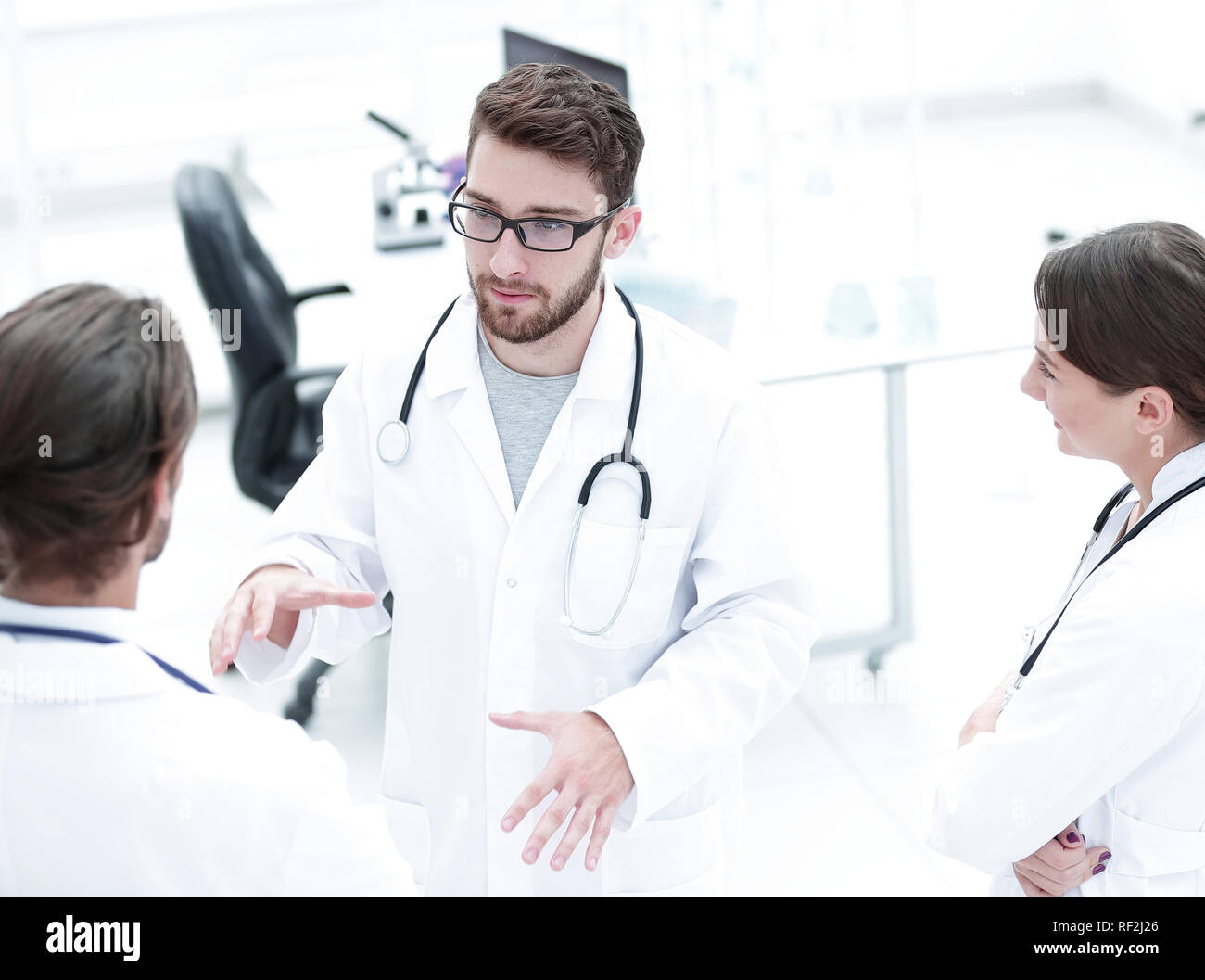 Group of doctors talking Stock Photo - Alamy