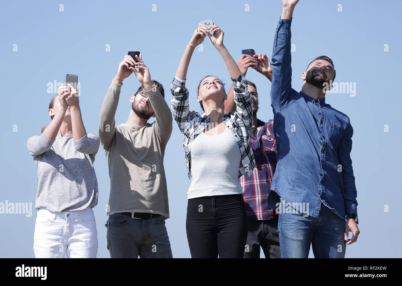 group of young people with smartphones Stock Photo - Alamy