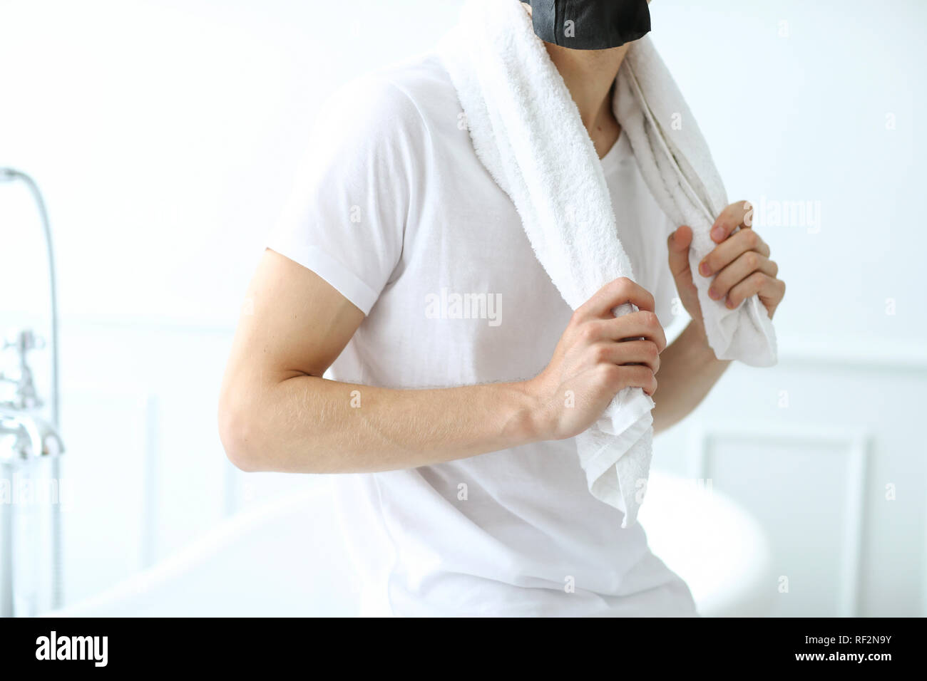Handsome guy in the bathroom Stock Photo - Alamy