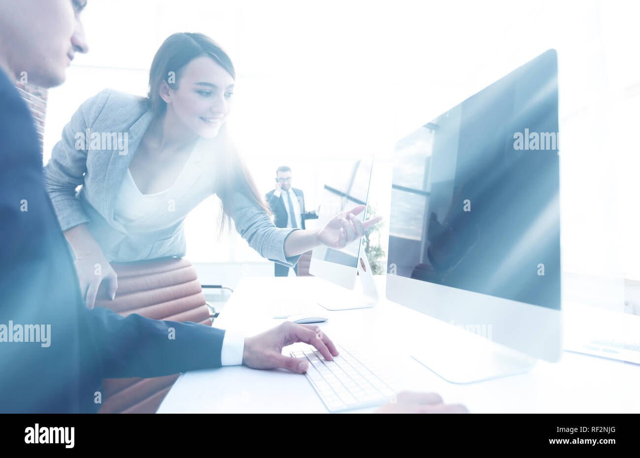 business woman pointing at the computer screen Stock Photo - Alamy