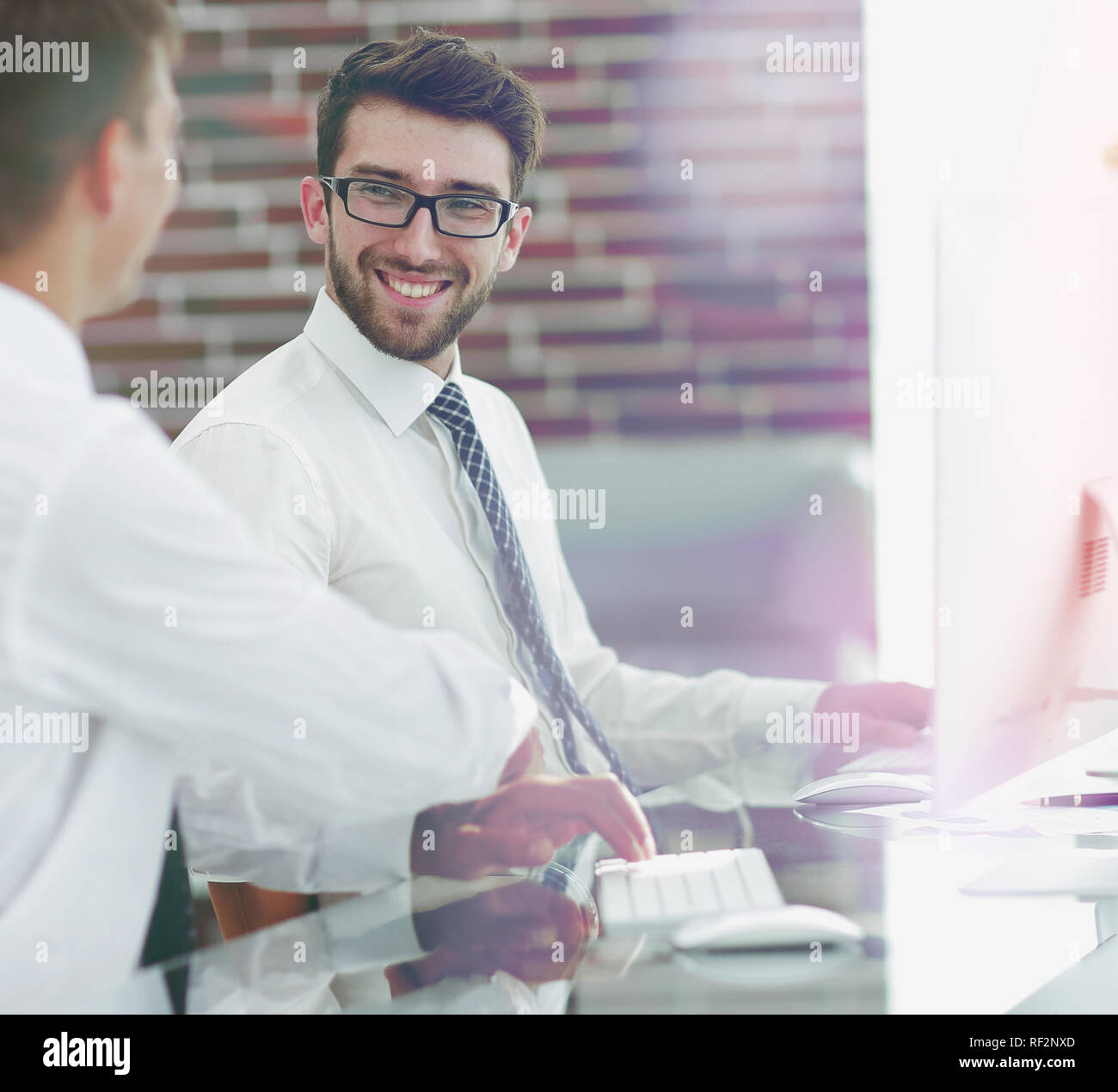 handshake of the employees at the Desk Stock Photo - Alamy