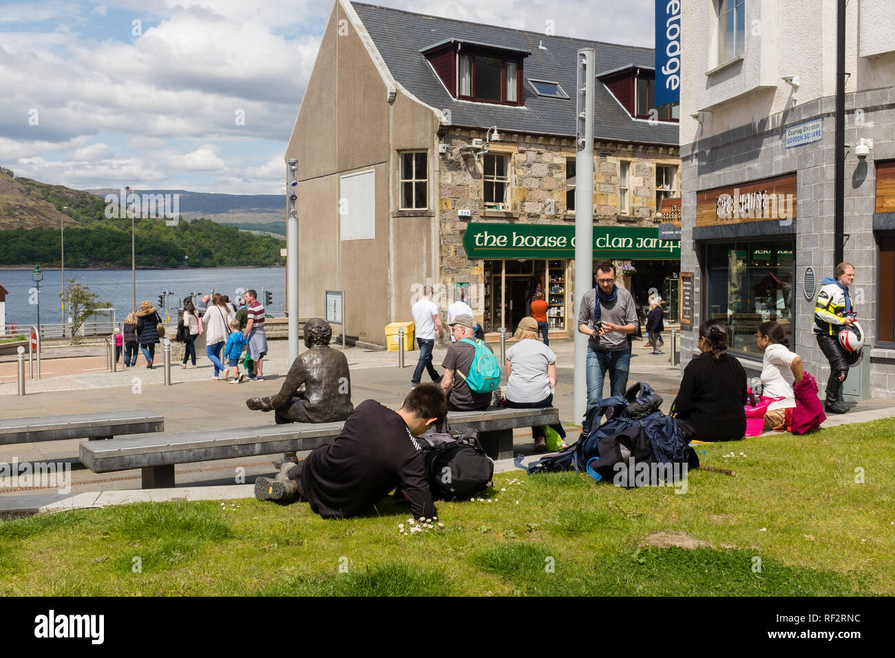 Tourists enjoying good weather beside official end of the west highland ...