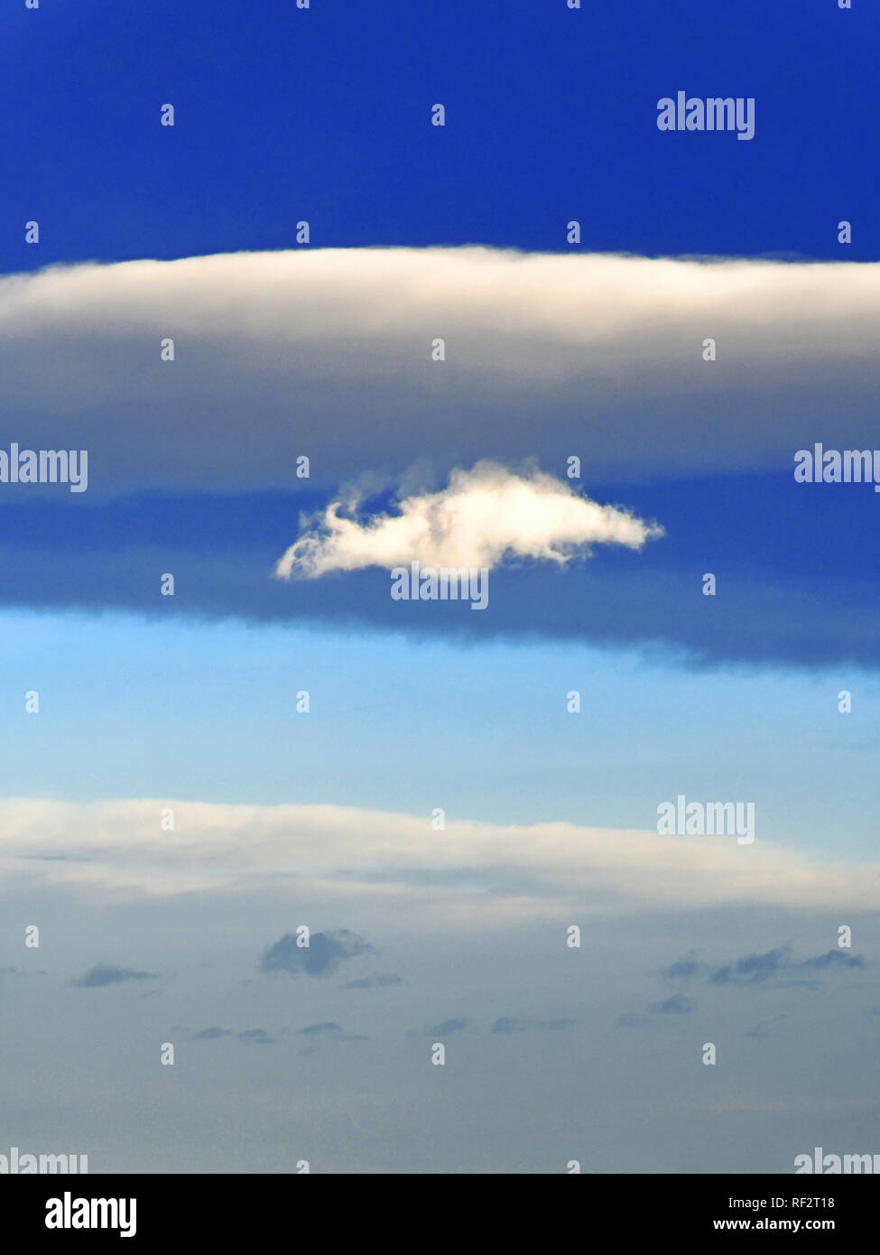 Varied blue sky and clouds with small white cloud centre Stock Photo ...