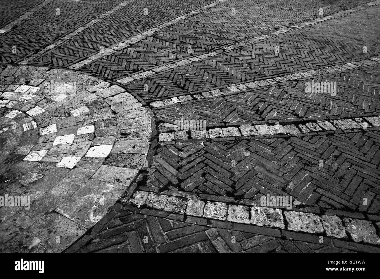 Detail of the brick and stone paving at the epicentre of the Piazza del ...