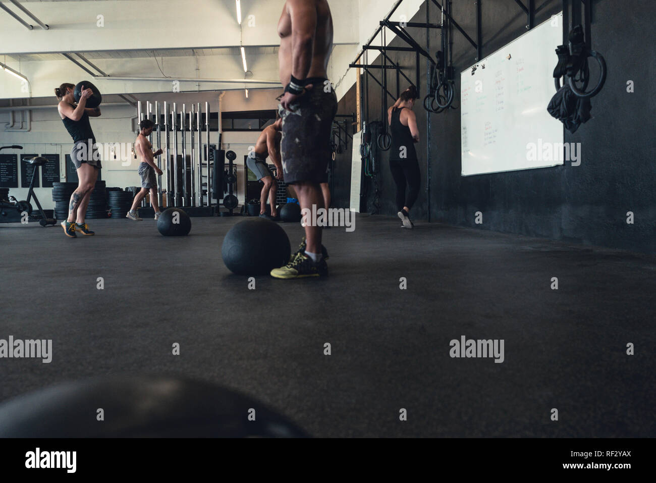 Authentic photos of men and women working out in gym setting. Gym ...