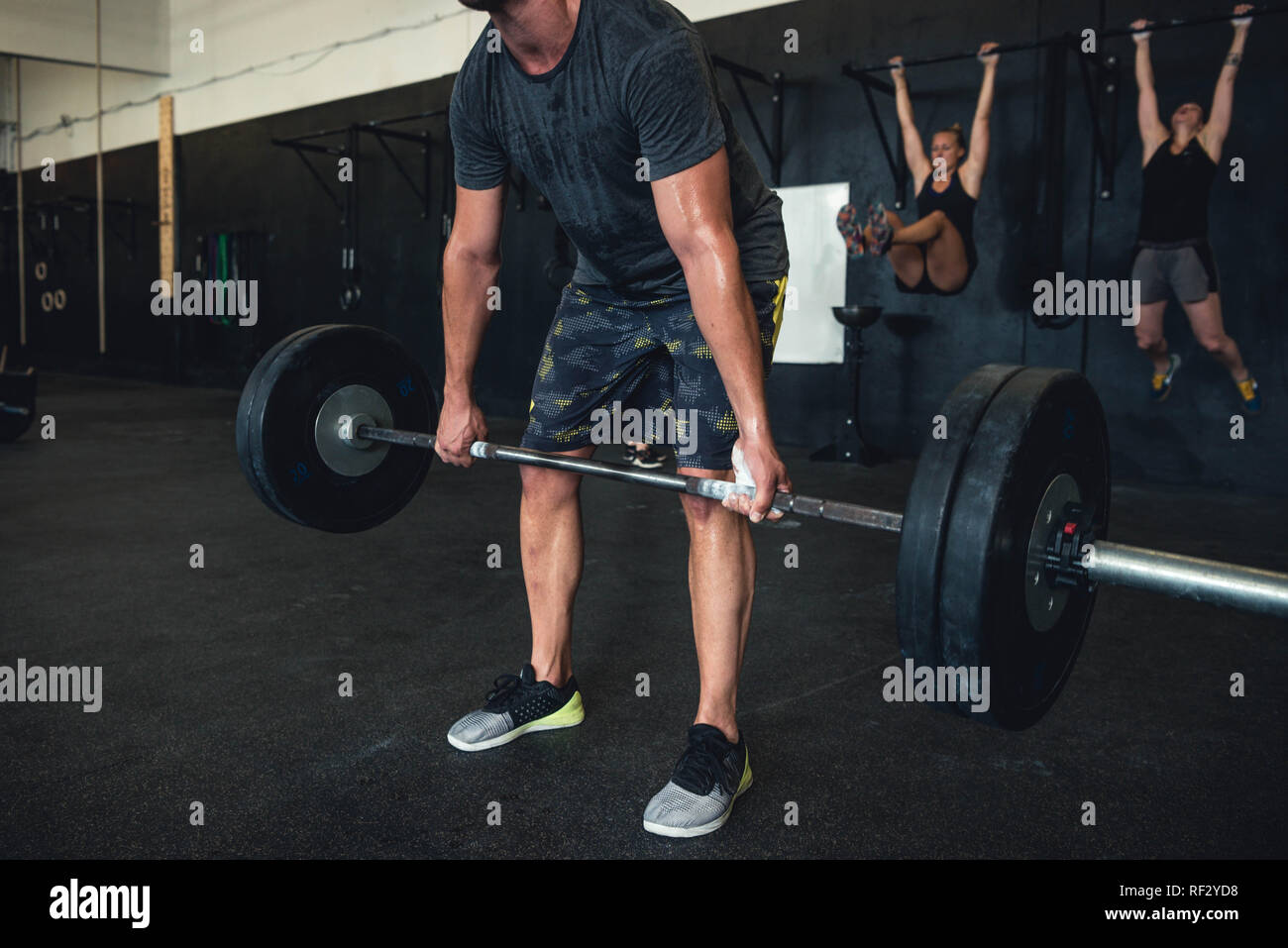 Athletic authentic fitness models working out in a gym environment ...