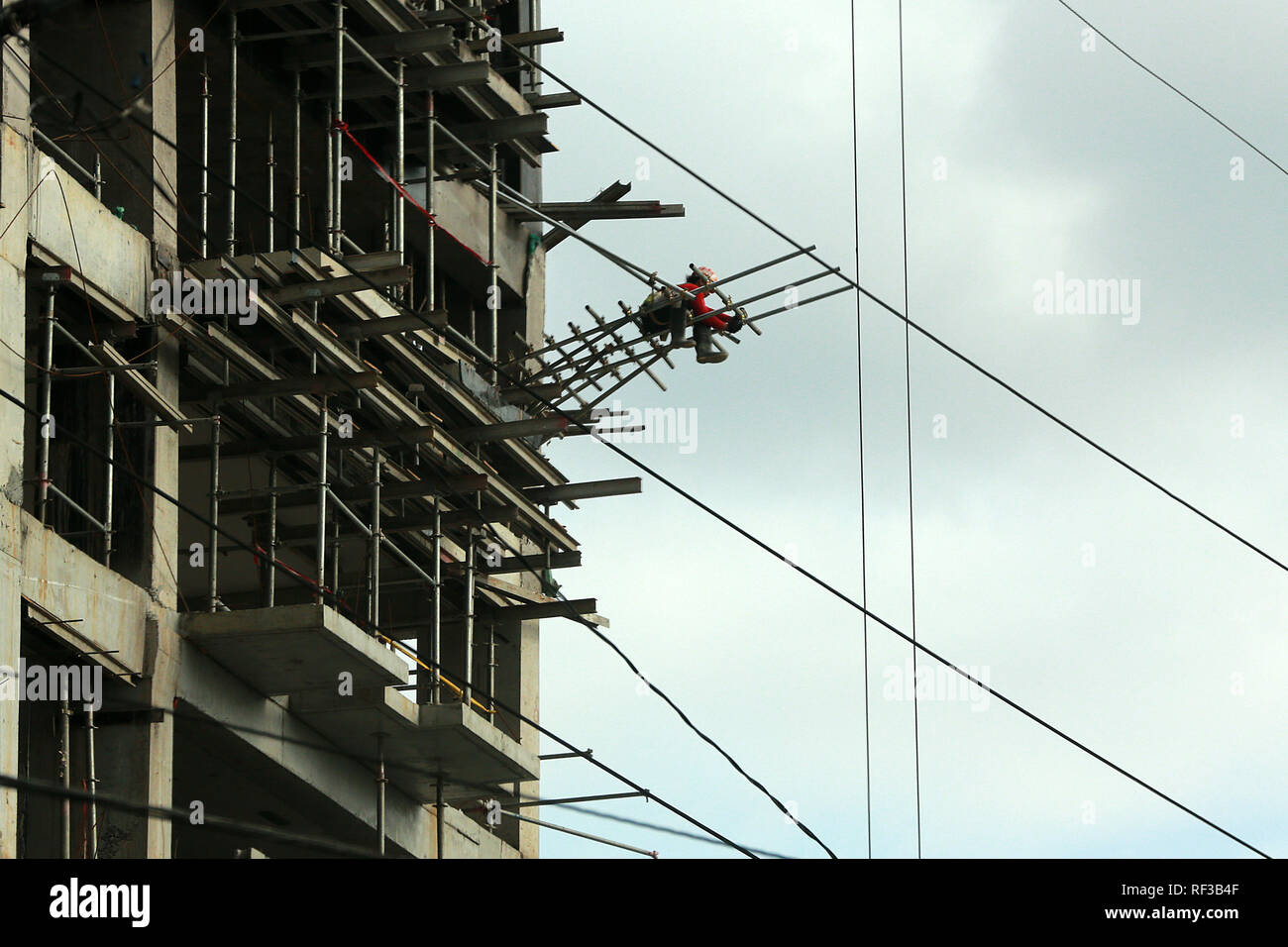 Quezon City, Philippines. 24th Jan, 2019. A laborer works at a ...