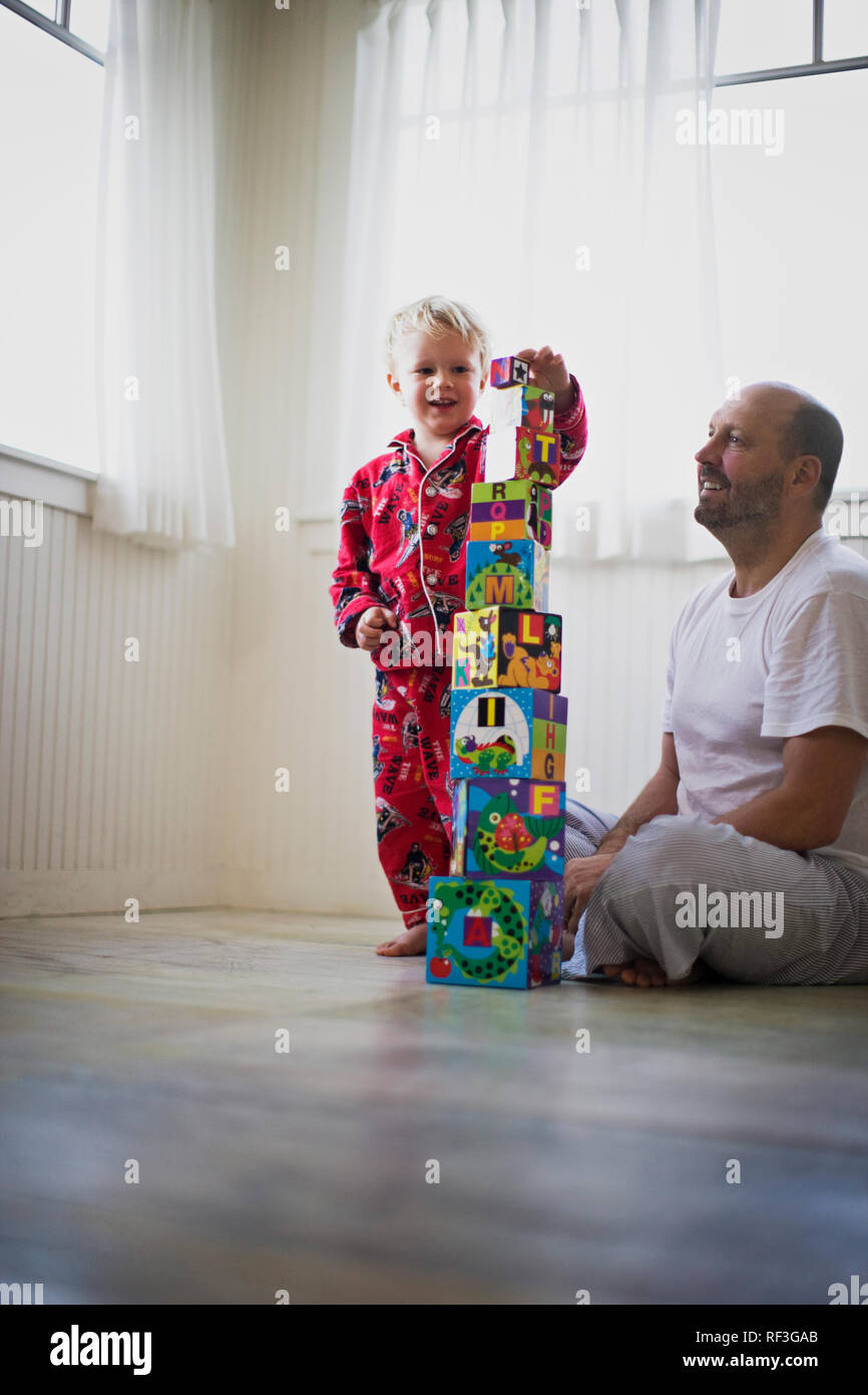 Two boys block tower building hi-res stock photography and images - Alamy