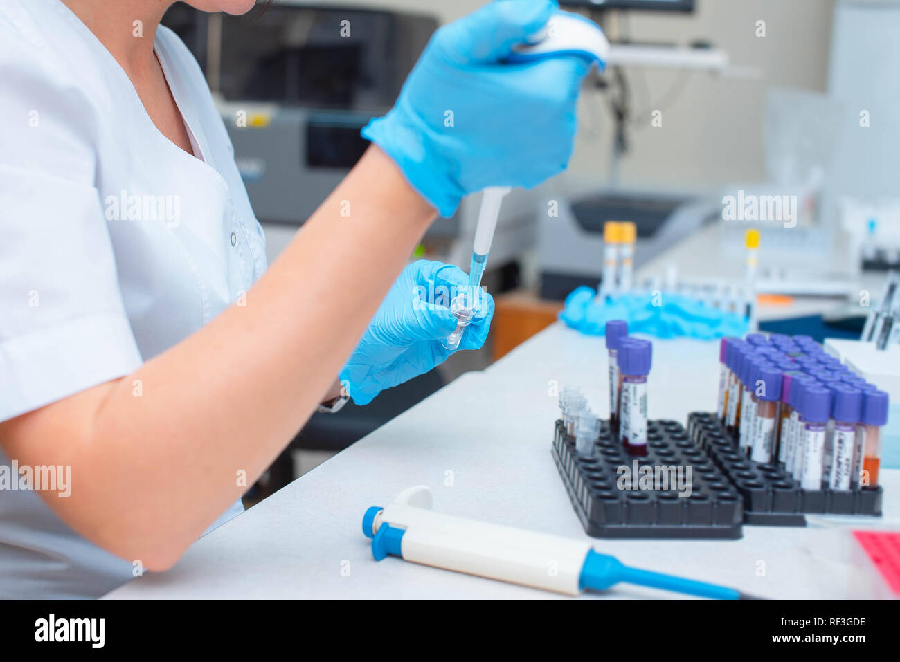 Blood test in the laboratory. Laboratory assistant working with the ...